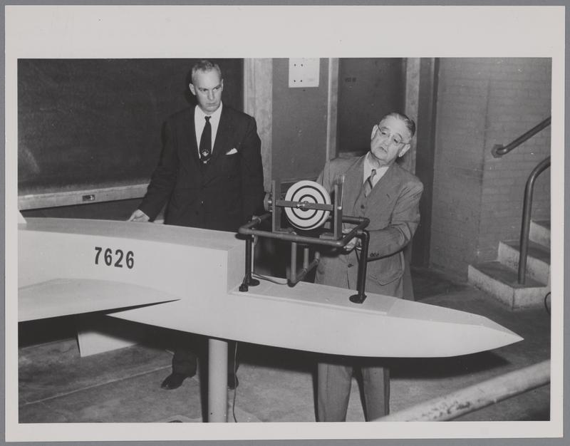 Charles Stark Draper and W. Wrigley with inertial guidance system ...